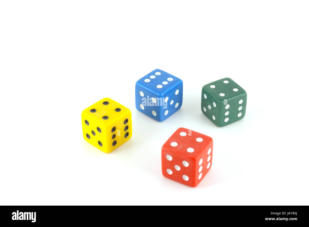 Four color dice over white Stock Photo - Alamy