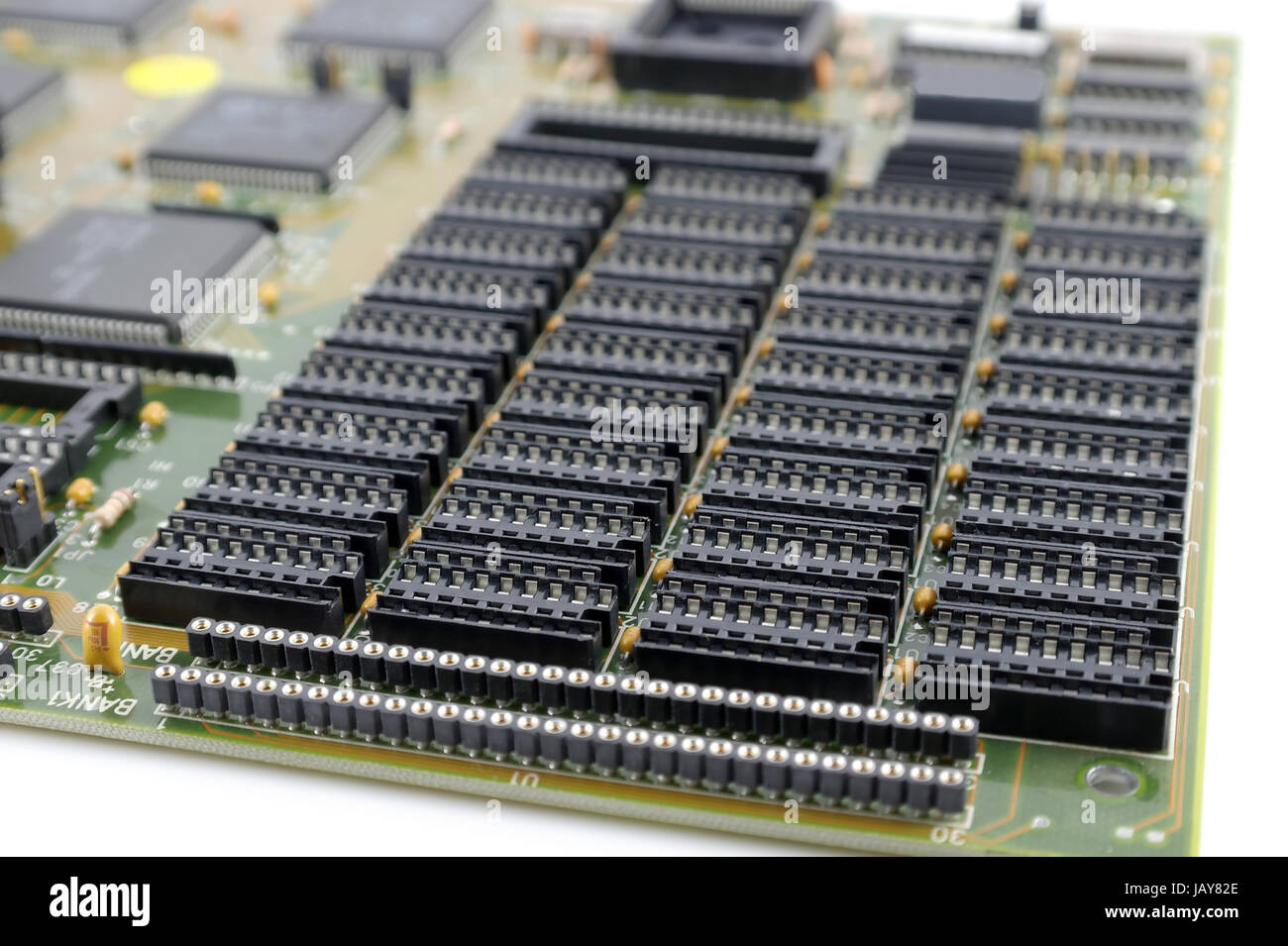 Old mainboard for PC with plug-and-sockets for memory. Shallow DOF ...