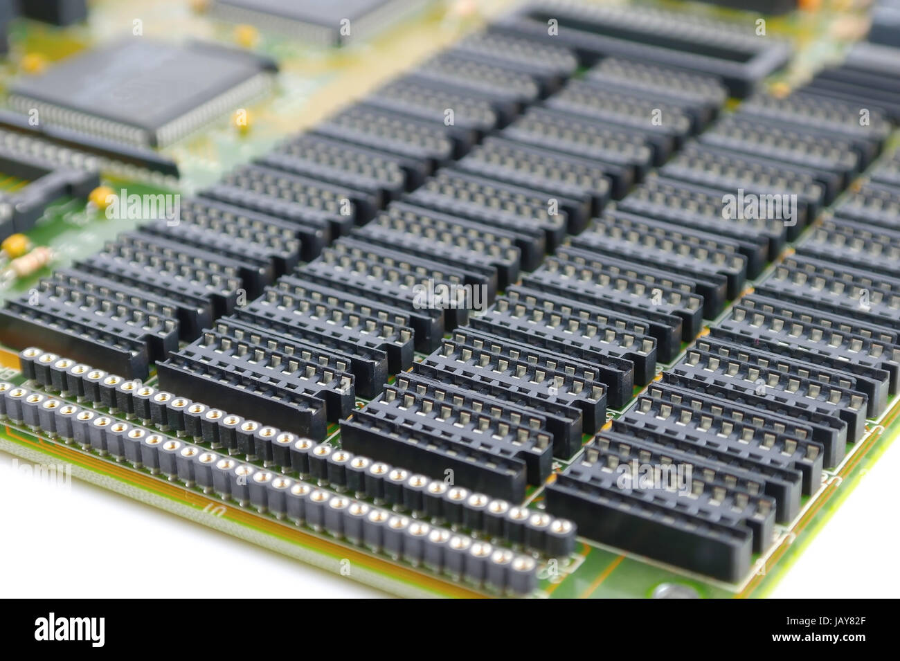 Old mainboard for PC with plug-and-sockets for memory. Shallow DOF ...