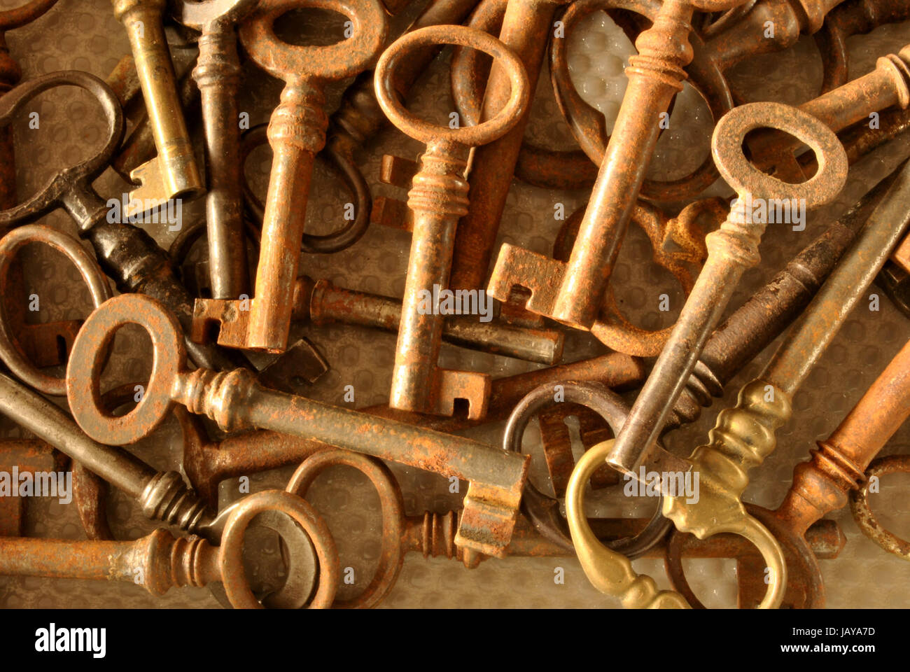 Series of rusty antique keys to open doors old Stock Photo - Alamy
