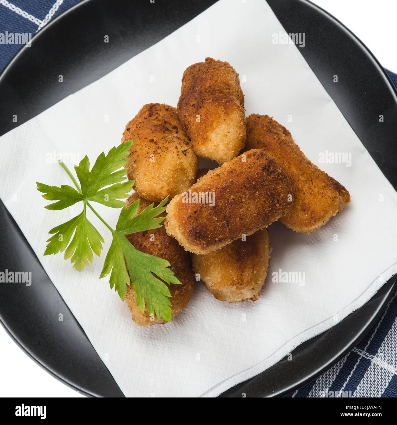 A plate with homemade croquettes decorated with parsley Stock Photo - Alamy