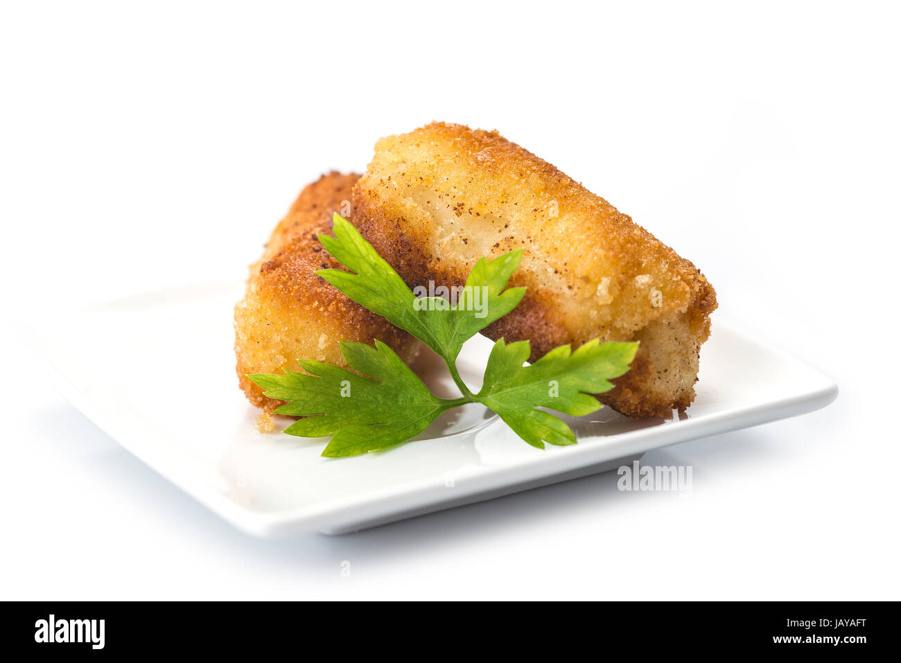 A plate with homemade croquettes decorated with parsley Stock Photo - Alamy