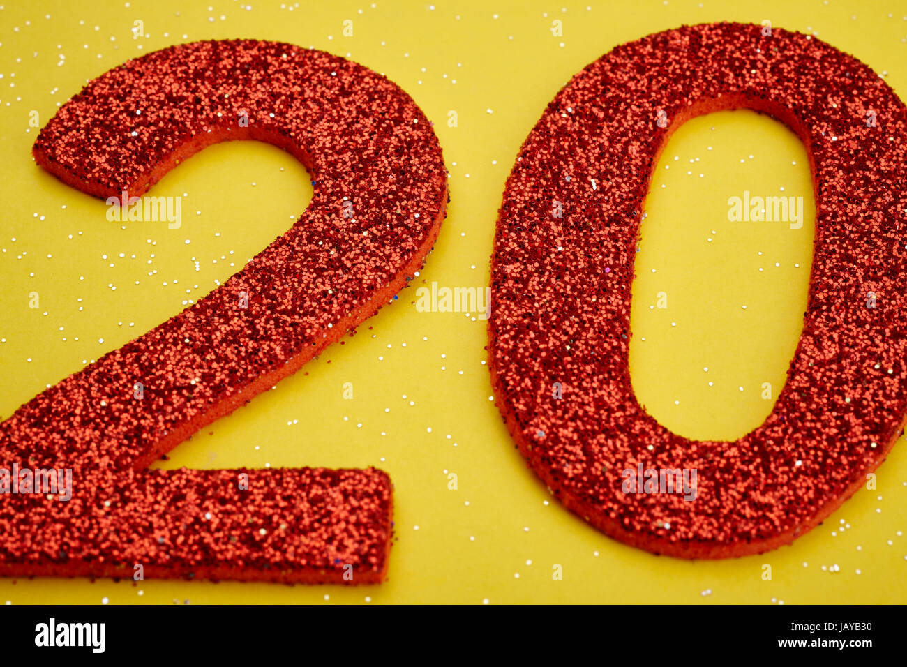 Number twenty red color over a yellow background. Anniversary ...