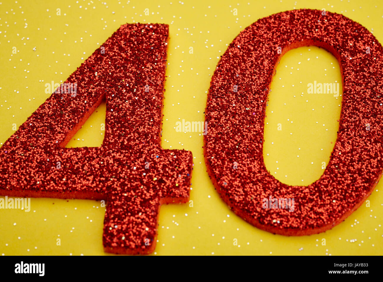 Number forty red color over a yellow background. Anniversary ...