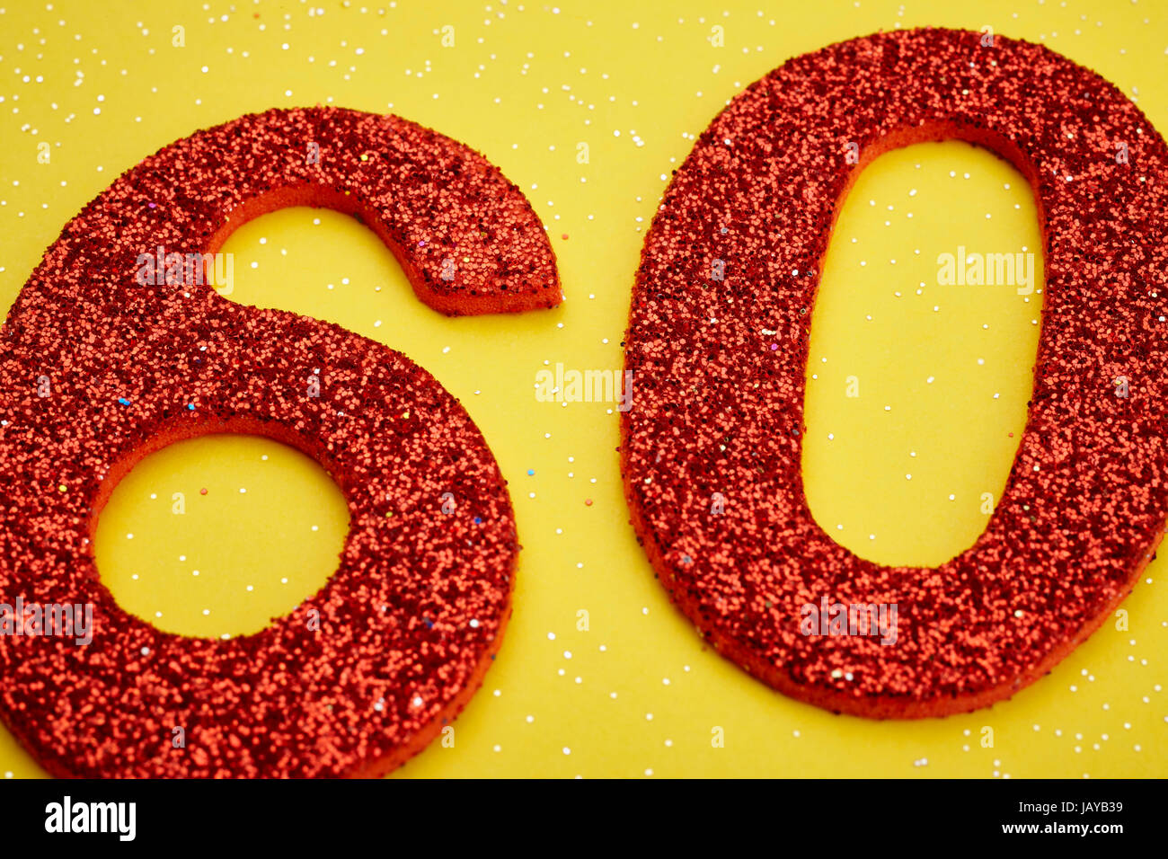 Number sixty red color over a yellow background. Anniversary ...
