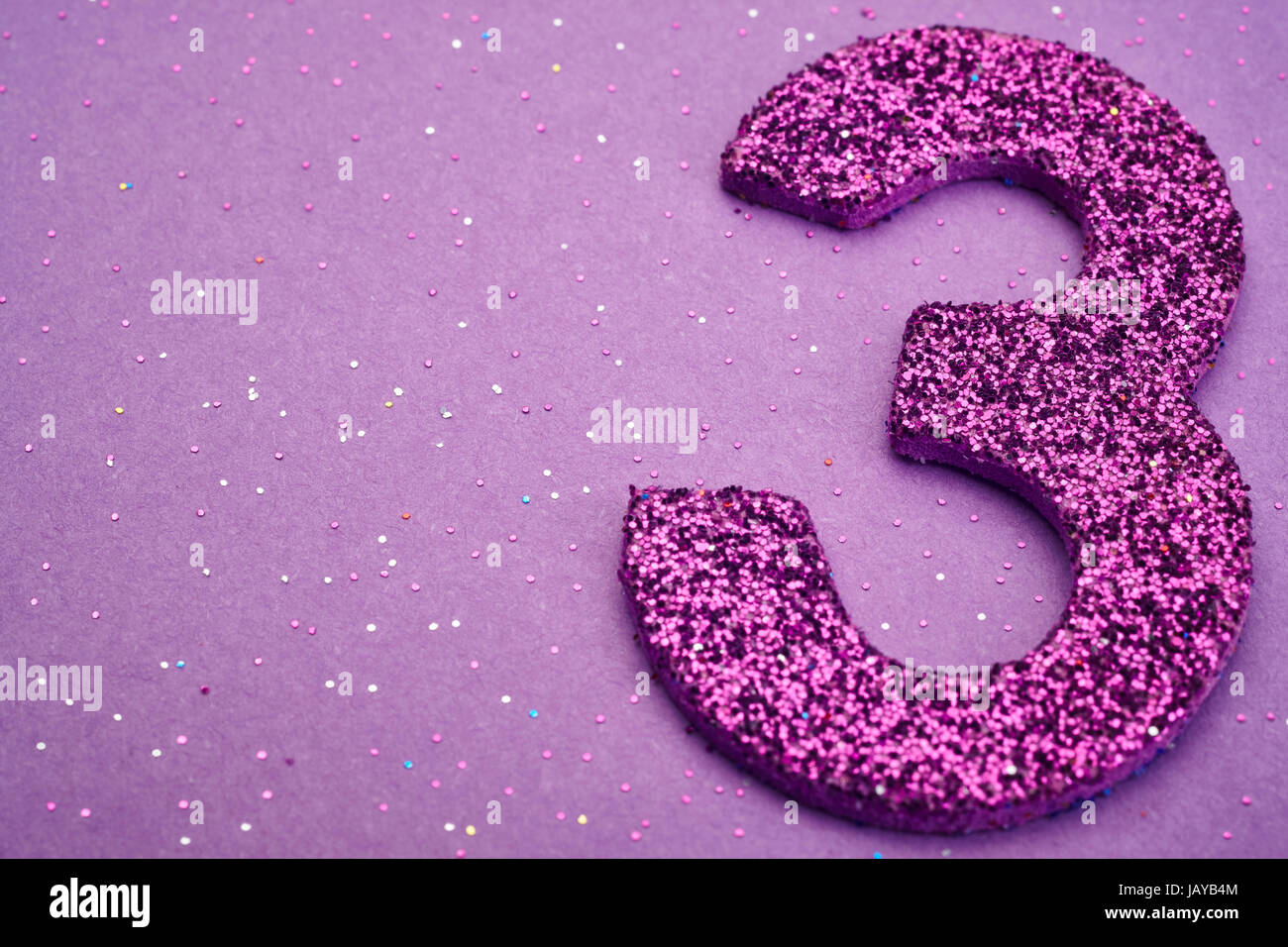 Number three purple color over a purple background. Anniversary ...