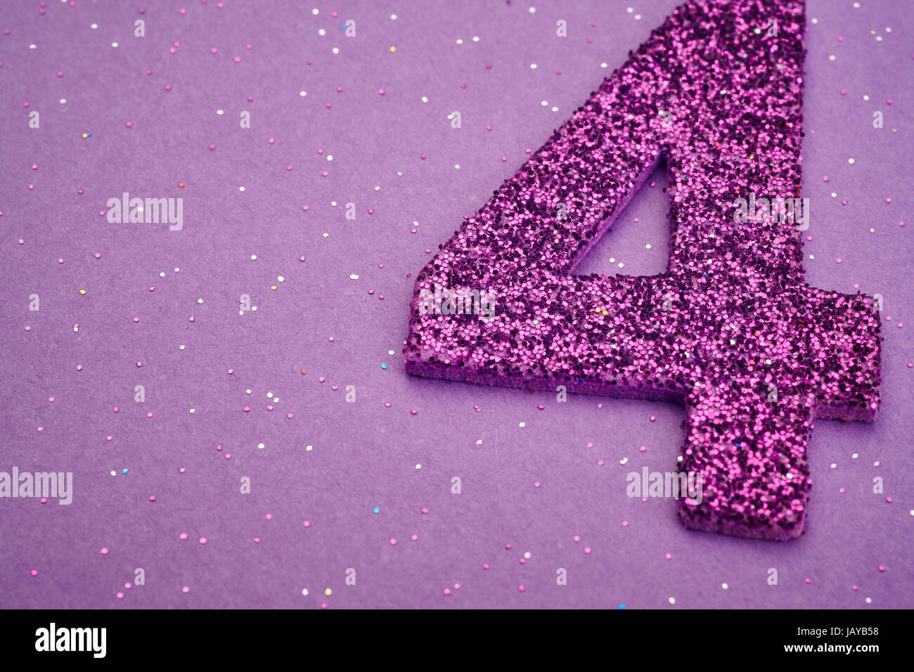 Number four purple color over a purple background. Anniversary ...