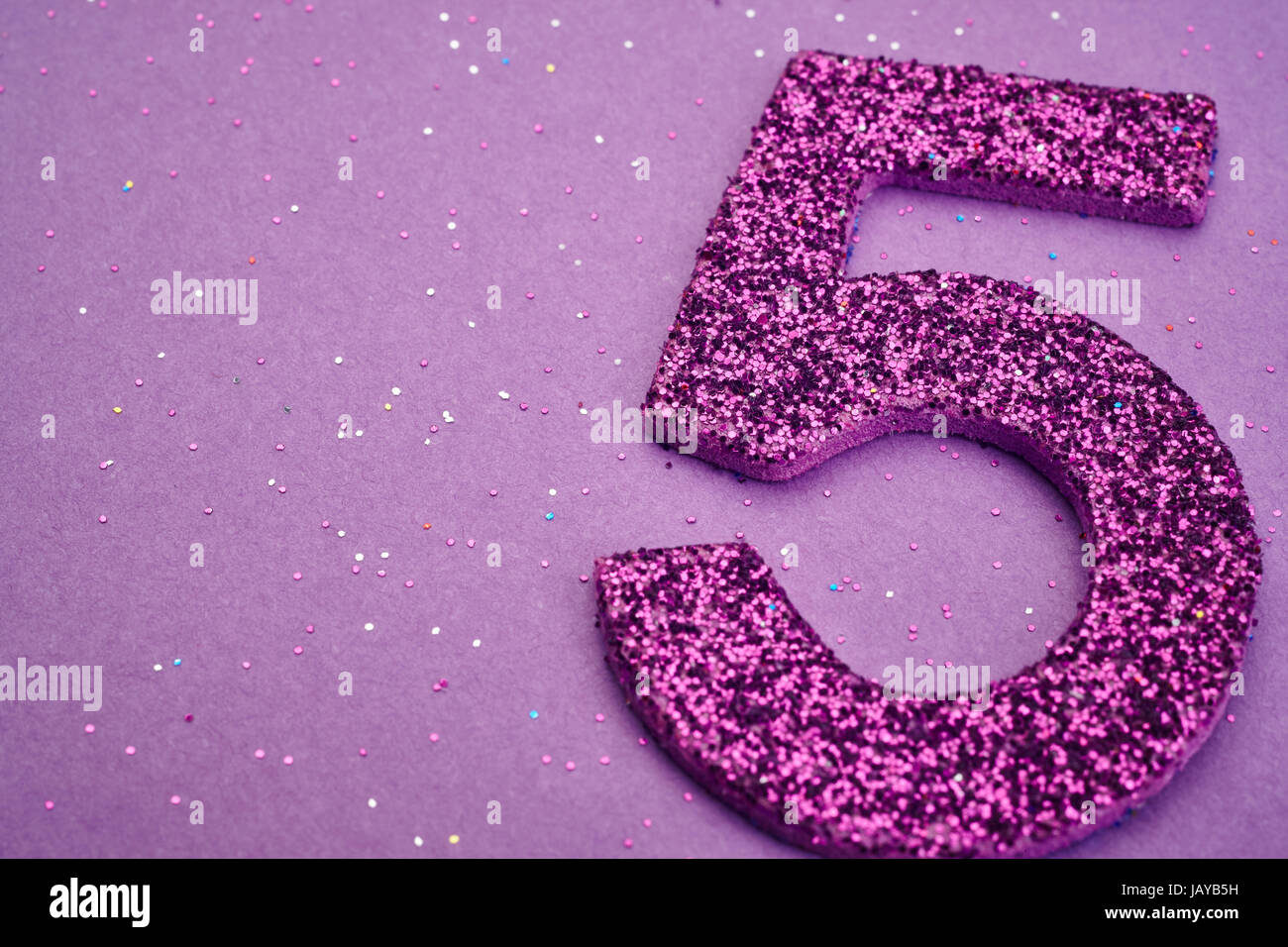 Number five purple color over a purple background. Anniversary ...