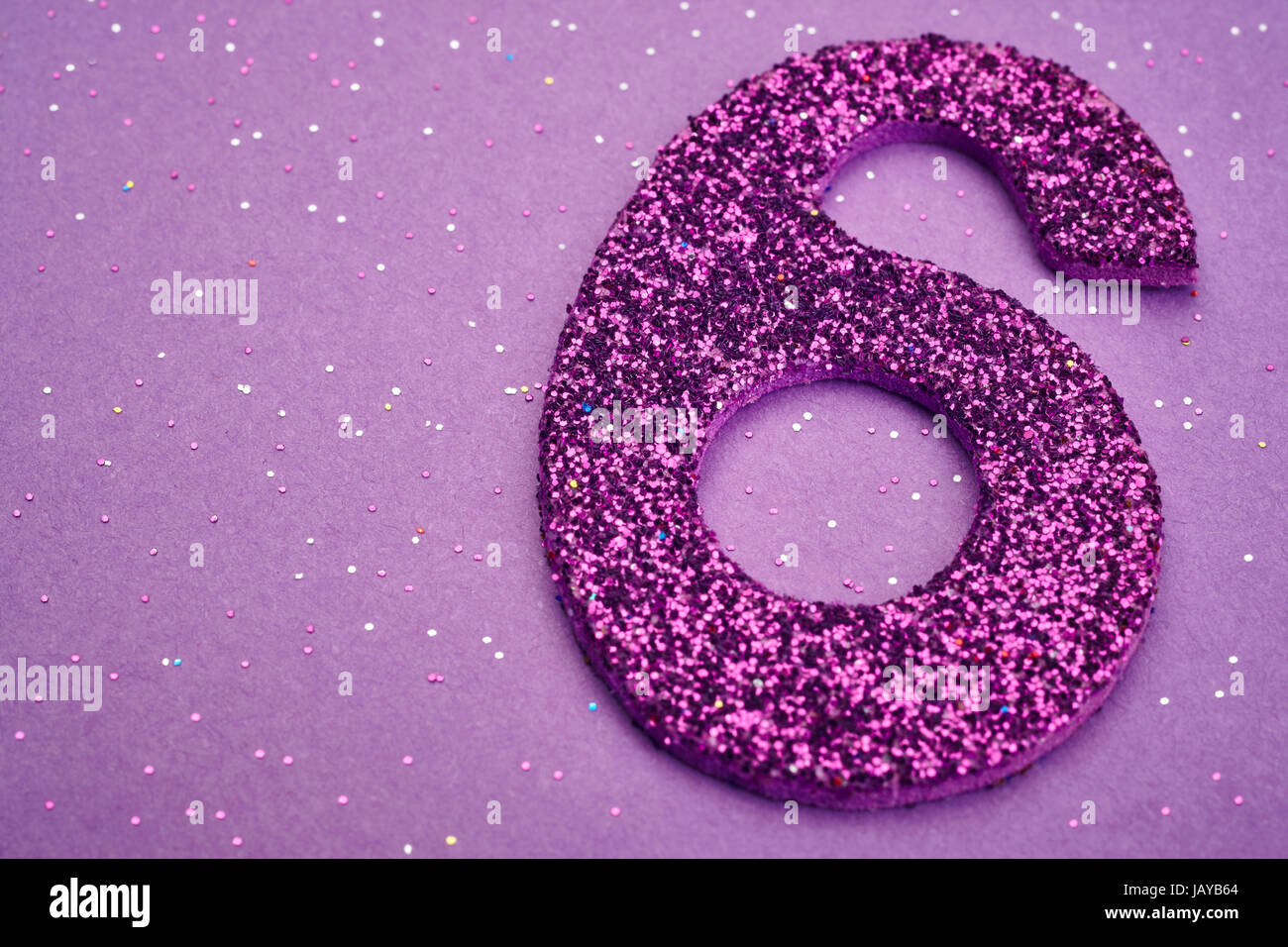 Number six purple color over a purple background. Anniversary ...