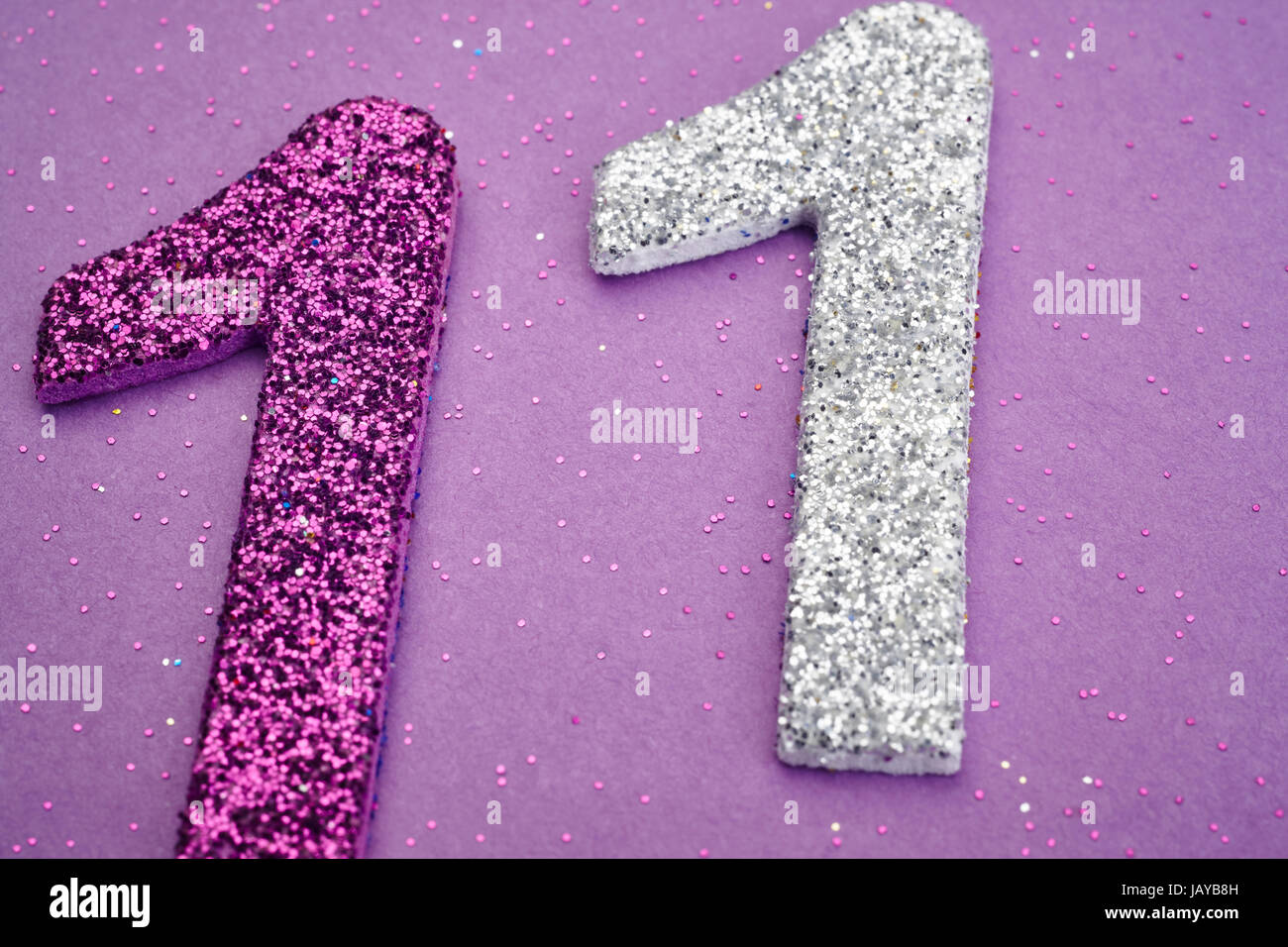 Number eleven purple silver color over a purple background. Anniversary ...