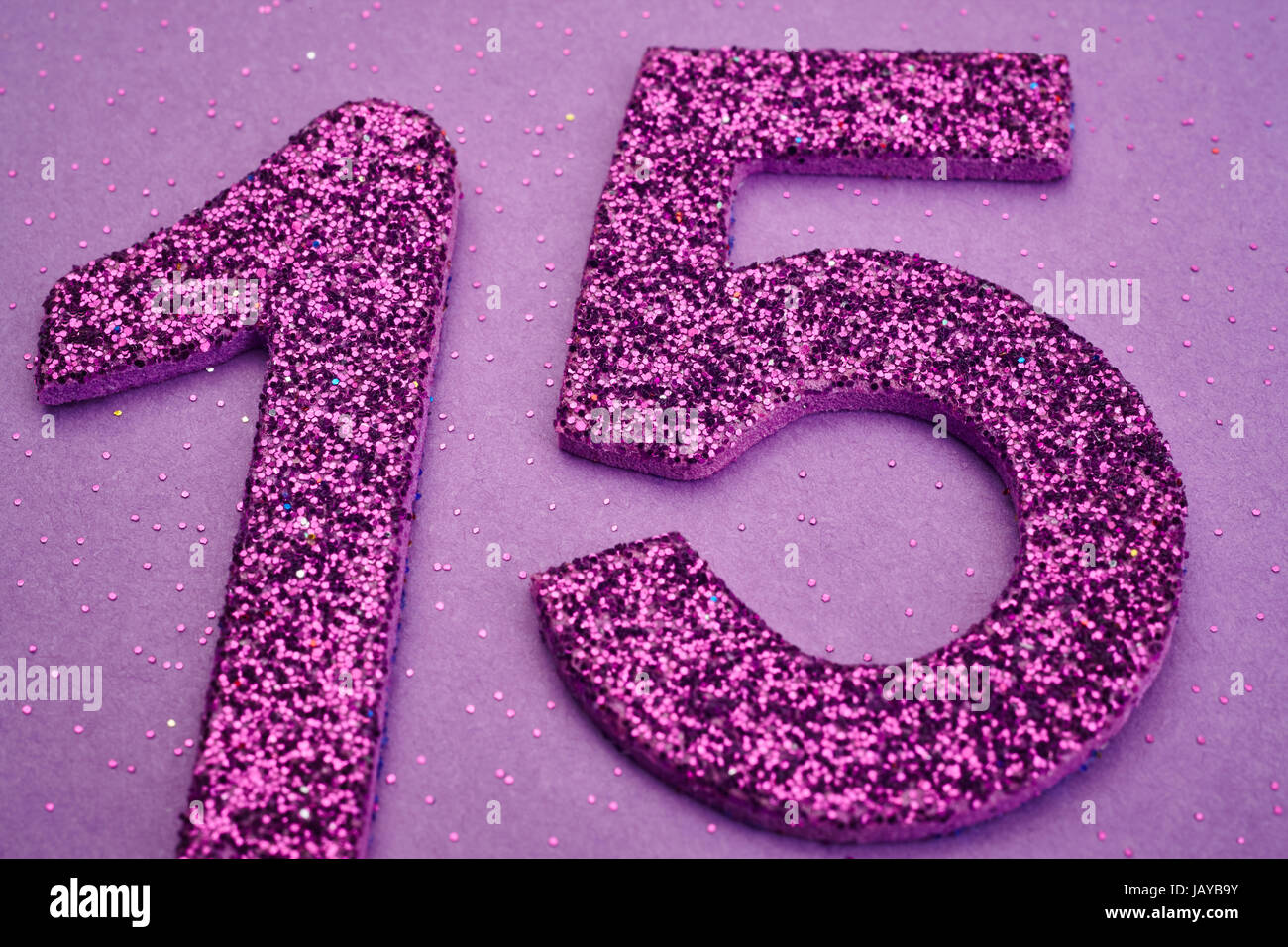 Number fifteen purple color over a purple background. Anniversary ...
