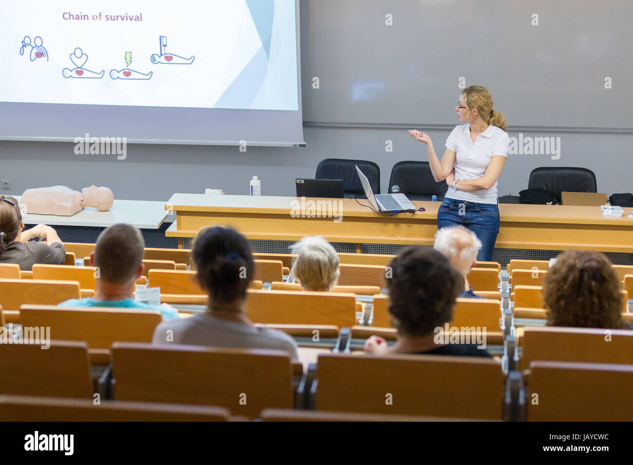 Instructor teaching first aid cardiopulmonary resuscitation course and ...
