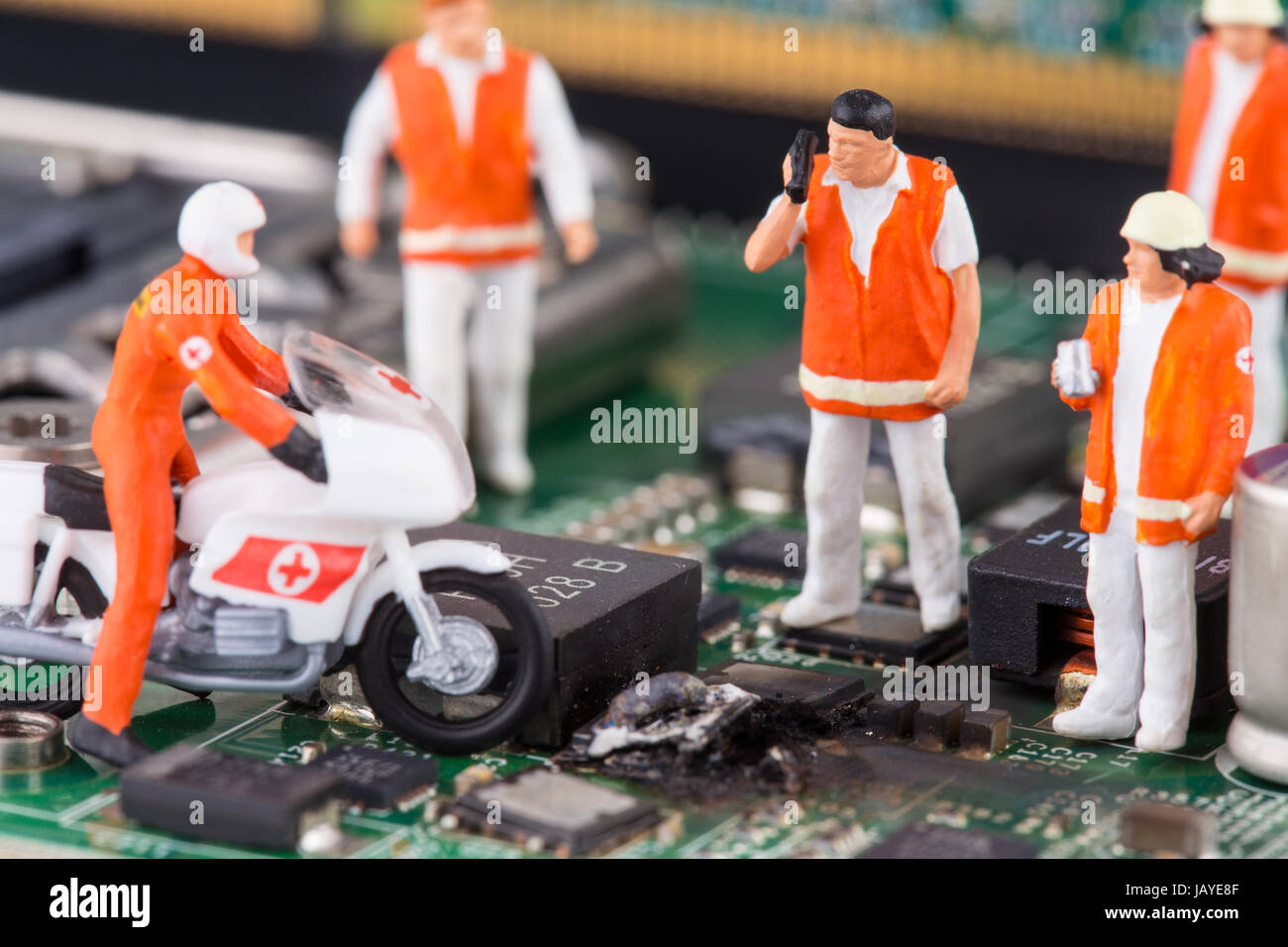 miniature workers on a computer mainboard - studio shot Stock Photo - Alamy
