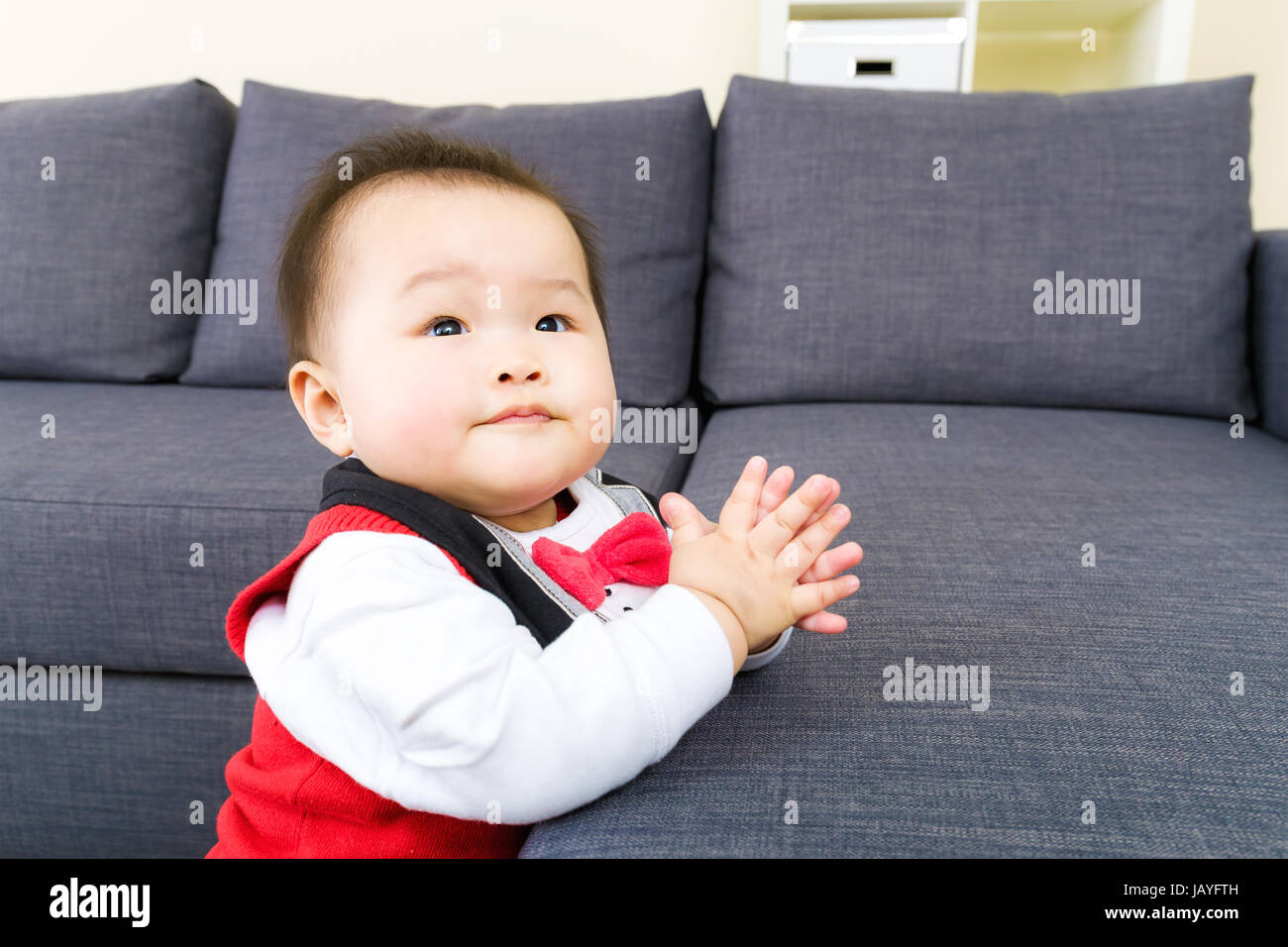 Little baby boy clapping Stock Photo - Alamy