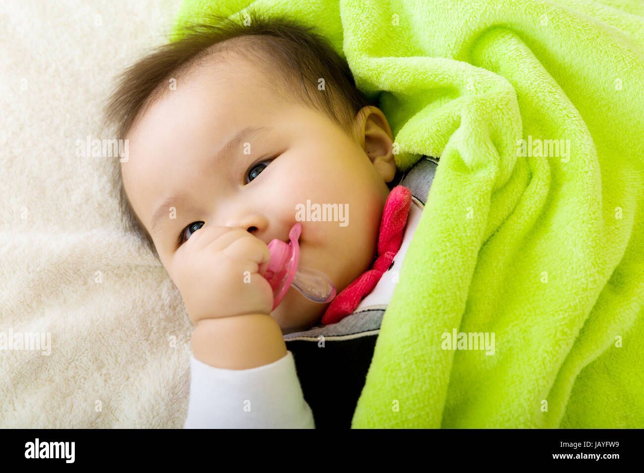 Baby bite pacifier Stock Photo - Alamy