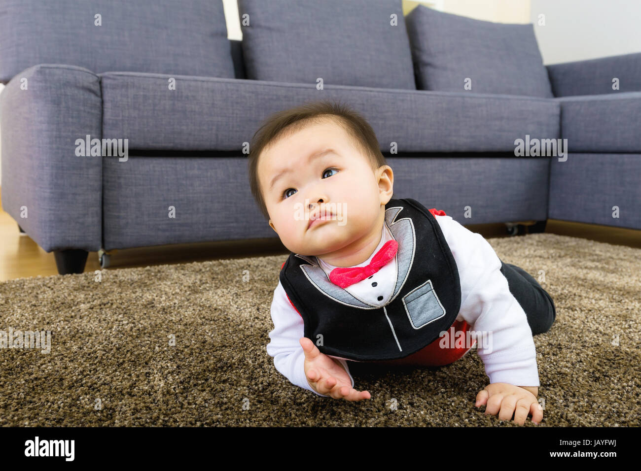 Little boy creeping at home Stock Photo - Alamy