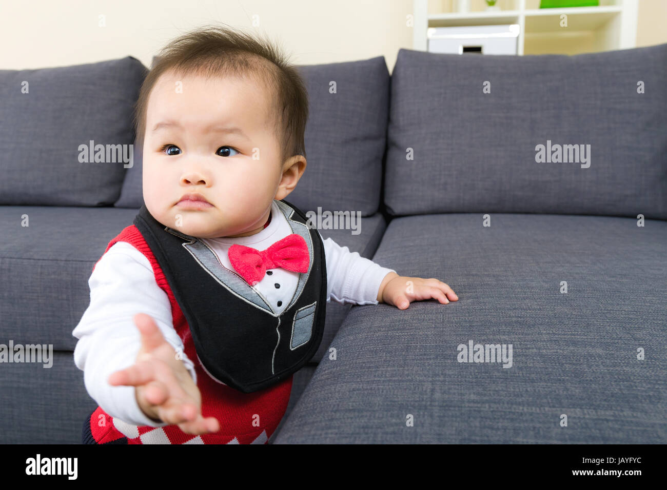 Little baby try to stand Stock Photo - Alamy