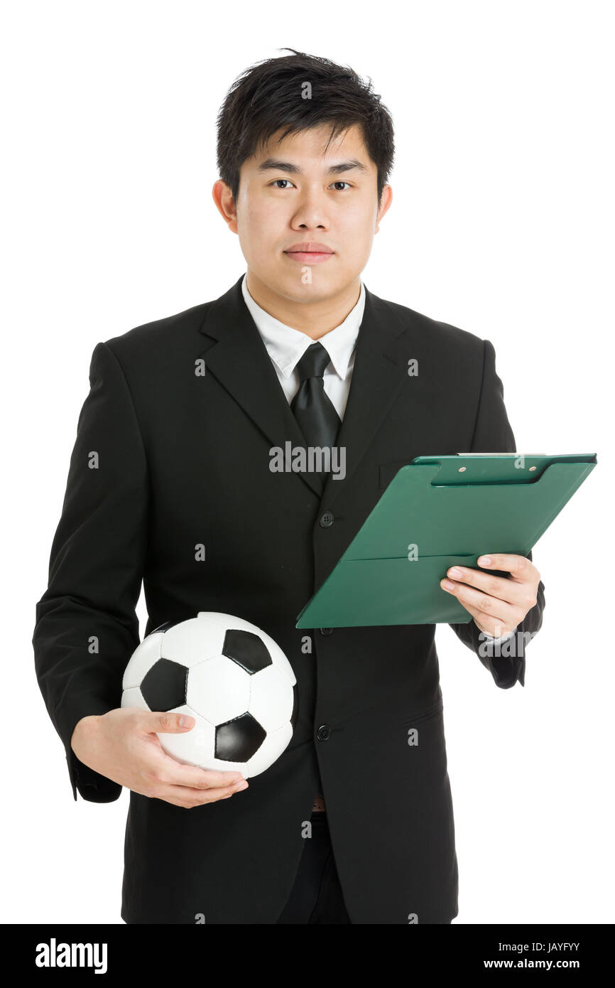 Football manager with soccer ball and tactcial board Stock Photo - Alamy