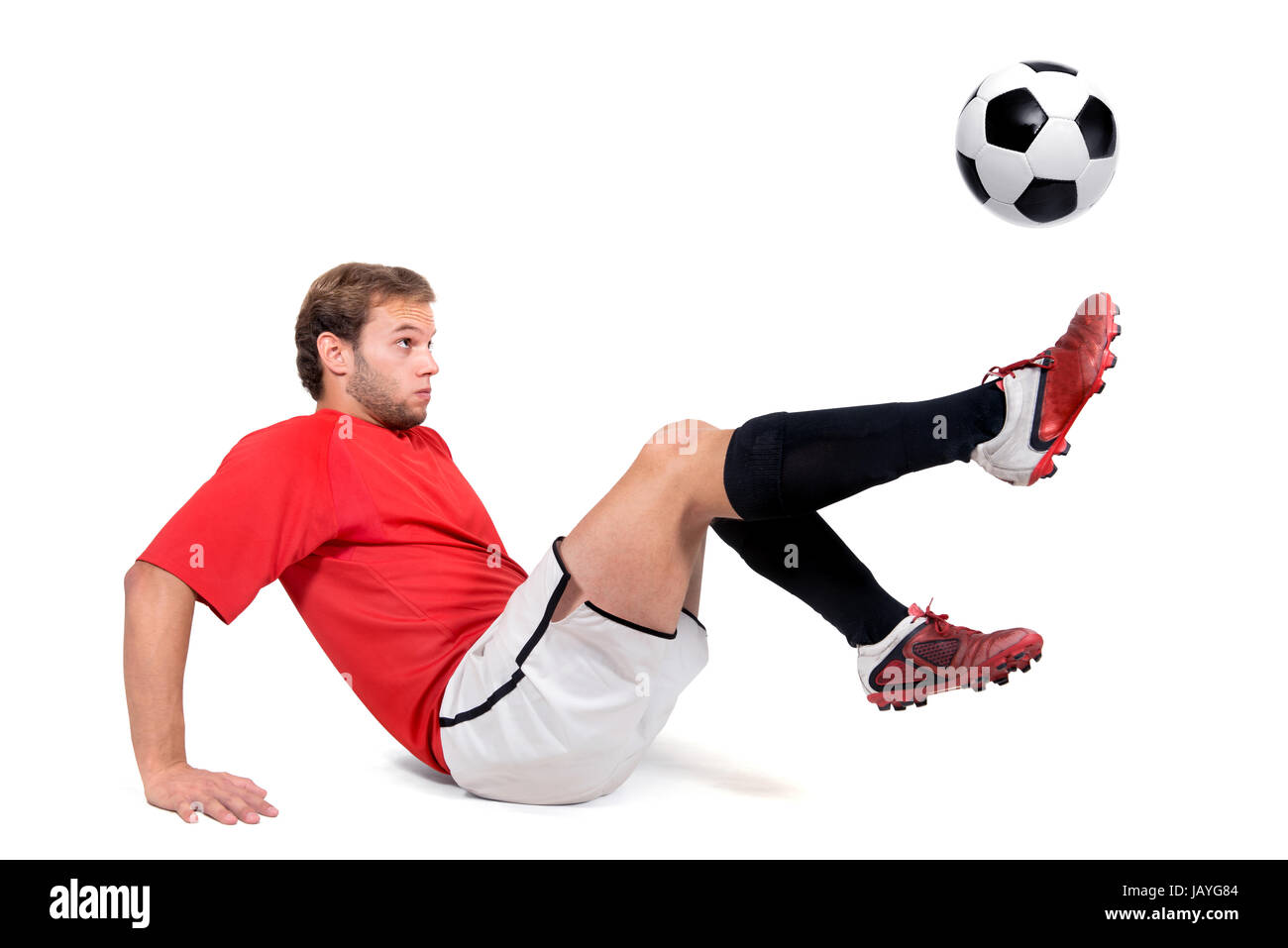 Football player with a ball isolated in white Stock Photo - Alamy