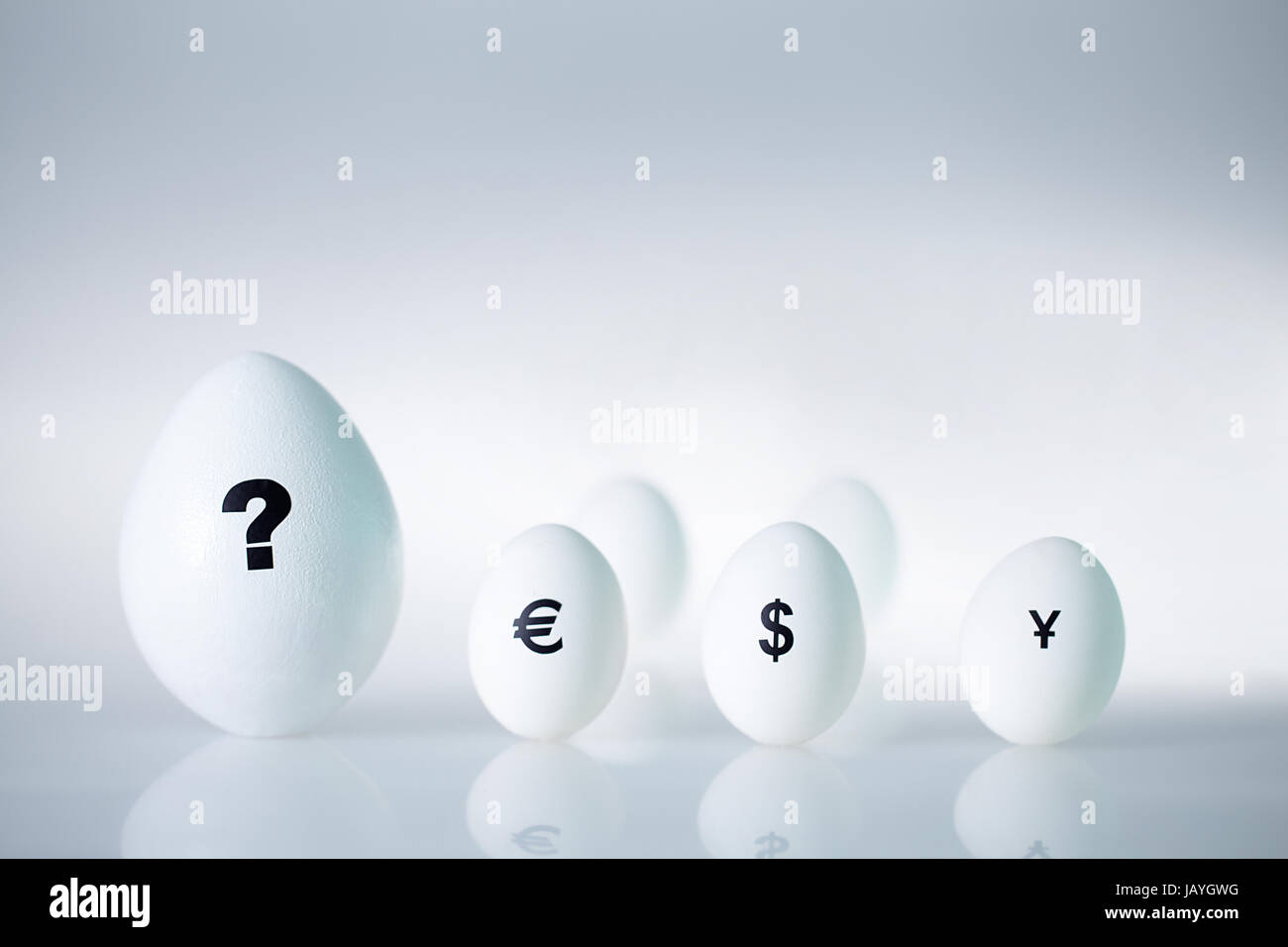 Close-up of big egg with question mark on it and several small eggs ...