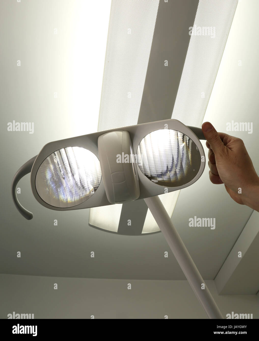 Powerful light in the medical facility and the hand of a surgeon who ...