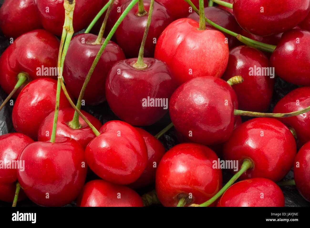 Beautiful red fresh cherry macro photo background Stock Photo - Alamy