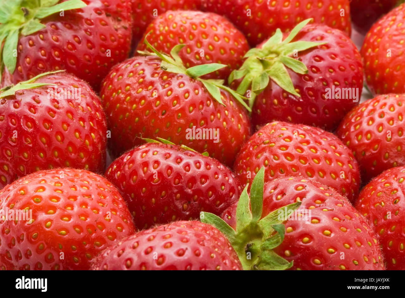 Red sweet strawberries making nice edible background Stock Photo - Alamy