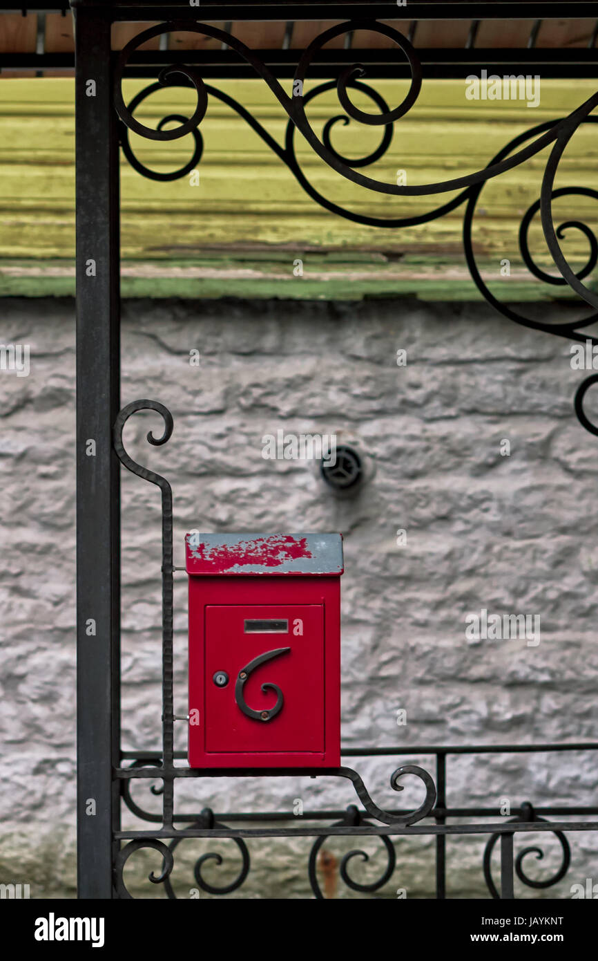 A lonely mailbox by the porch of an old house in Tallinn, Estonia. It ...