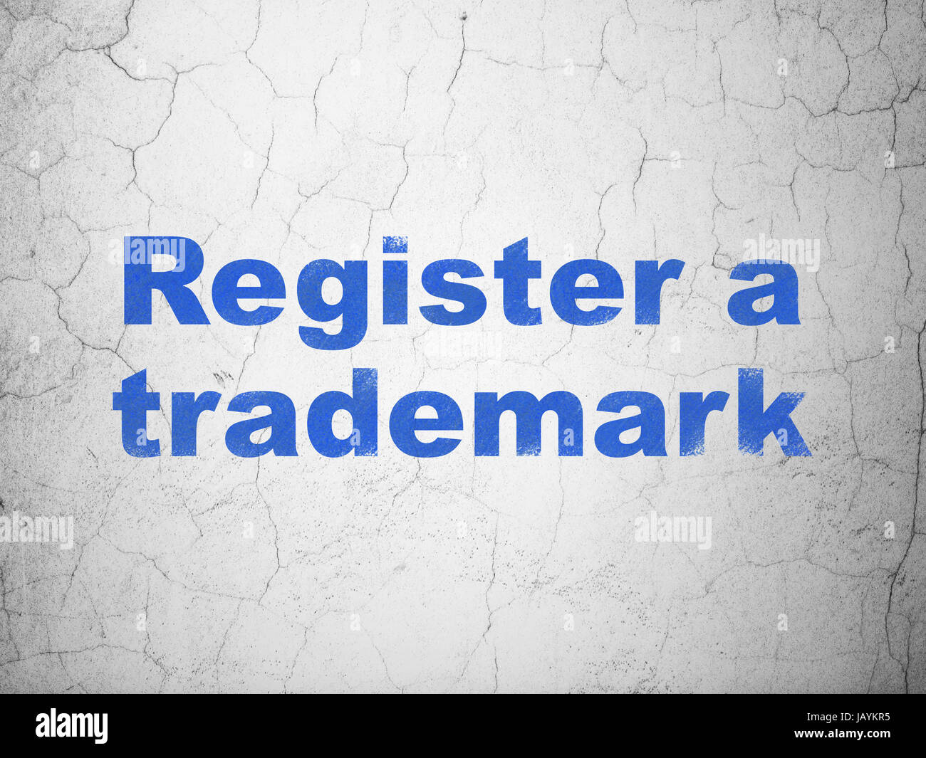 Law concept: Blue Register A Trademark on textured concrete wall ...