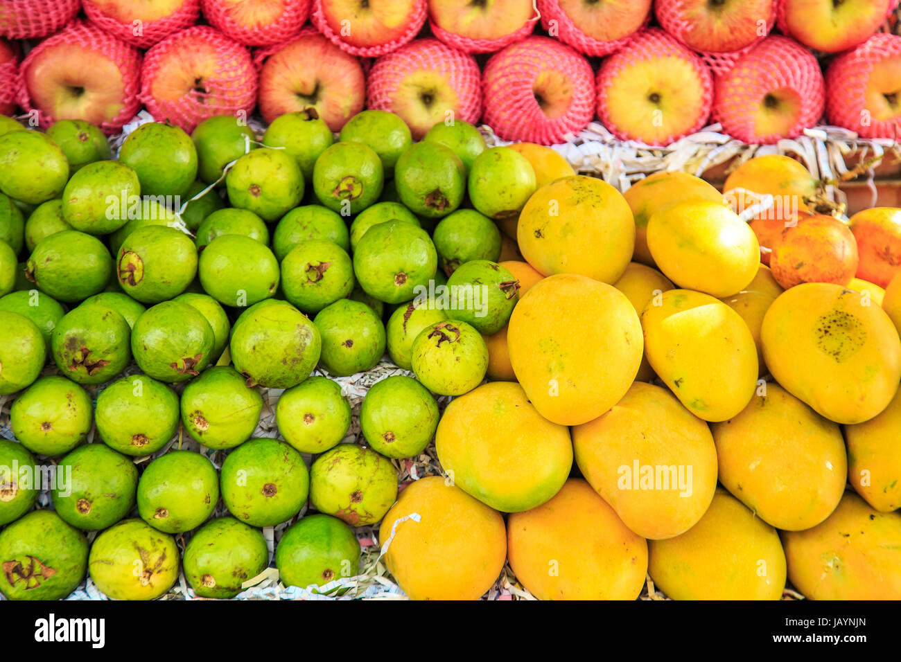 Mango, lime, apples in Indian market. Close-up fruit background Stock ...