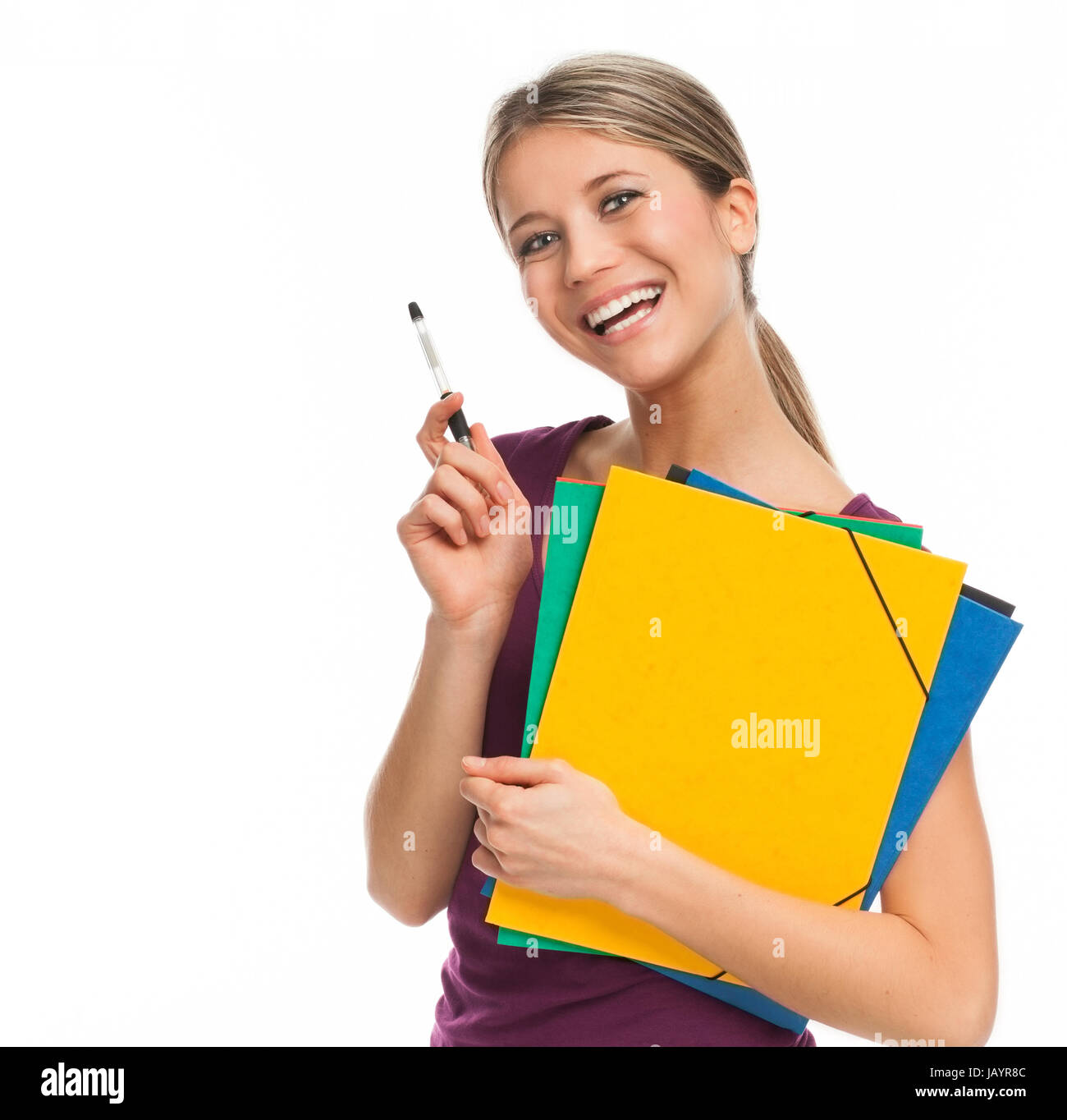 Young student smiling, holding folders and pen, isolated on white Stock ...