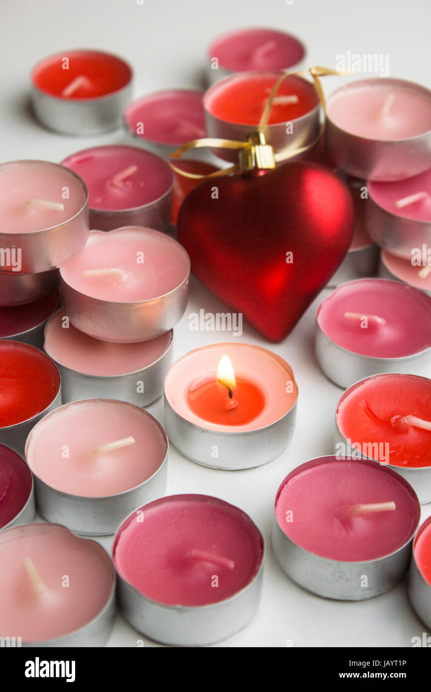 Different colors of candles in a indoor composition Stock Photo - Alamy