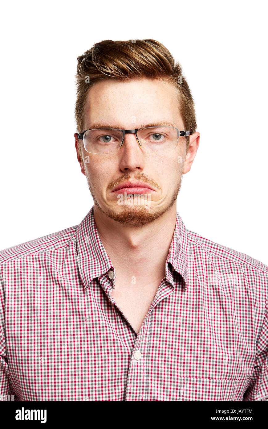 Young man makes a sad face. Isolated on white Stock Photo - Alamy