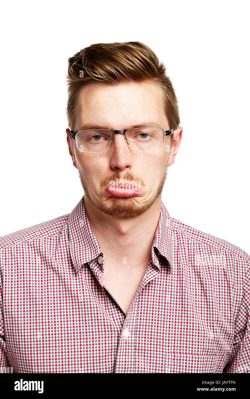 Young man makes a sad face. Isolated on white Stock Photo - Alamy