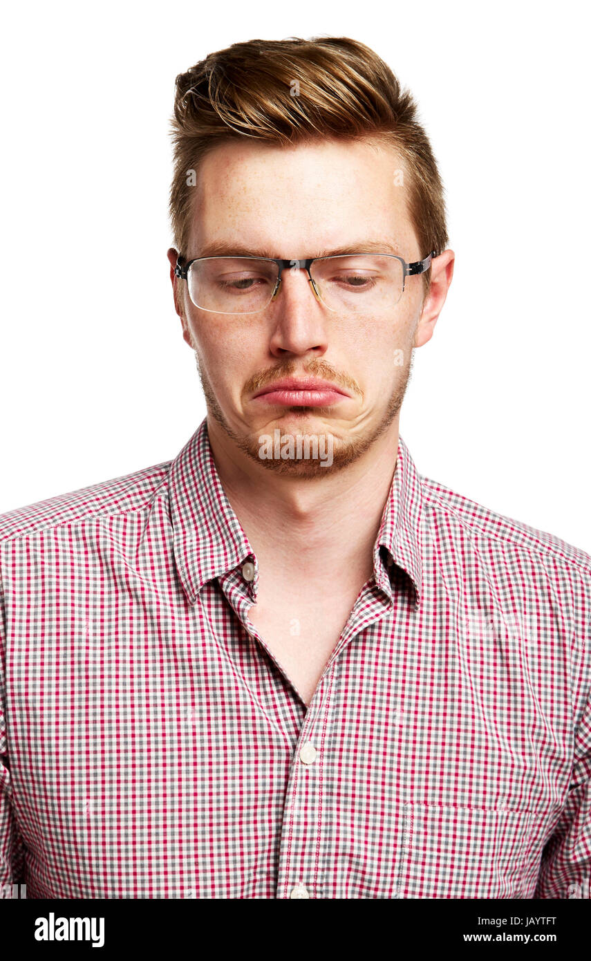 Young man makes a sad face. Isolated on white Stock Photo - Alamy