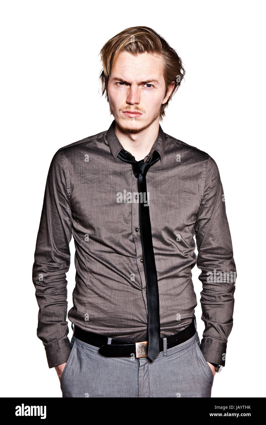 Studio photo of young man making a serious face Stock Photo - Alamy