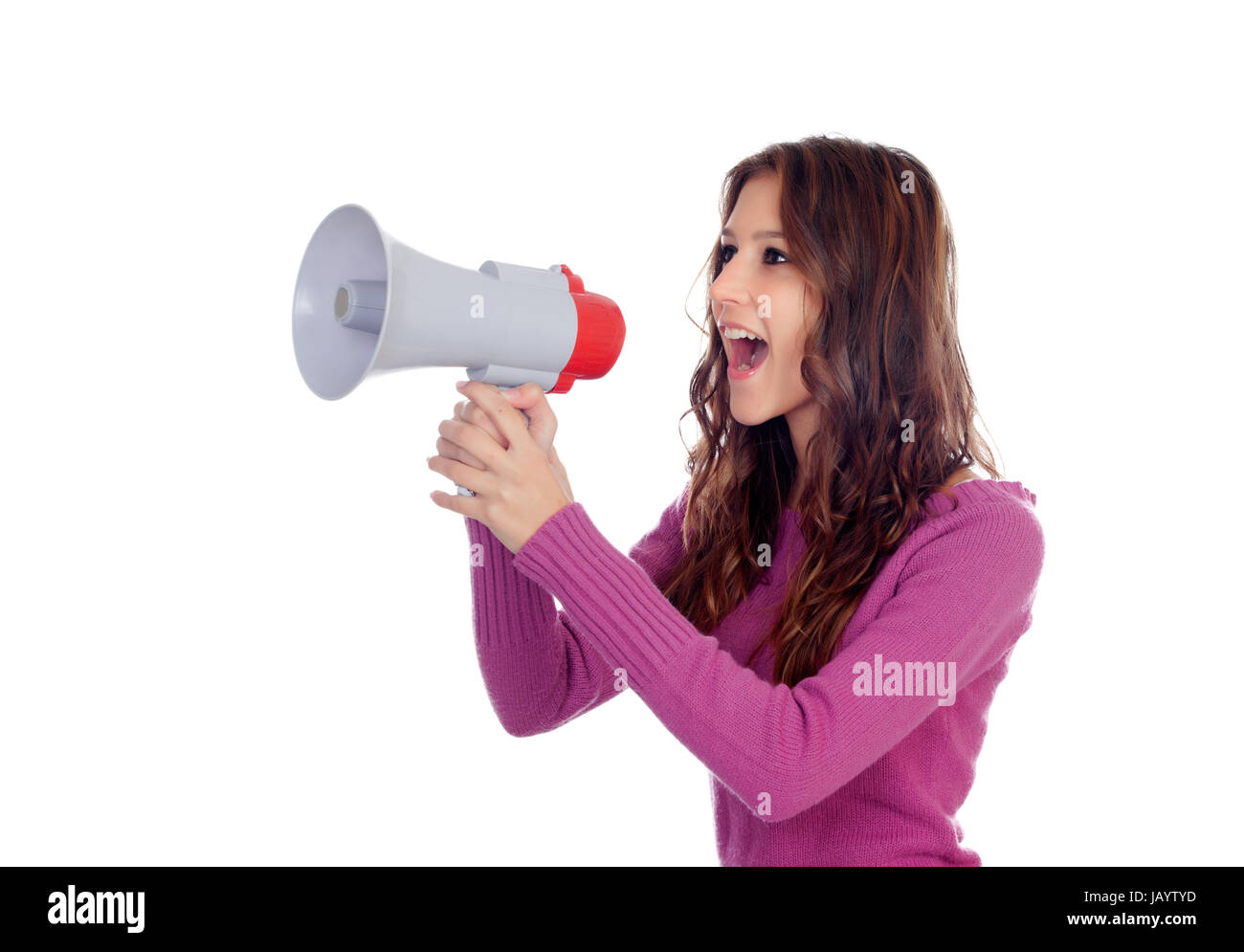 Attractive brunette girl shouting into a megaphone isolated on a white ...
