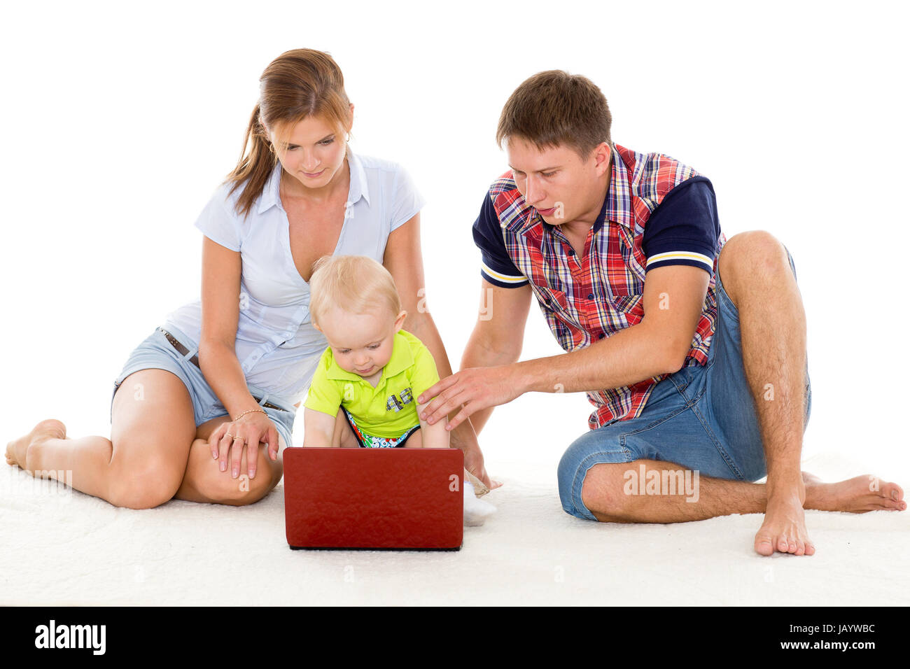 Happy family with notebook on a white background Stock Photo - Alamy