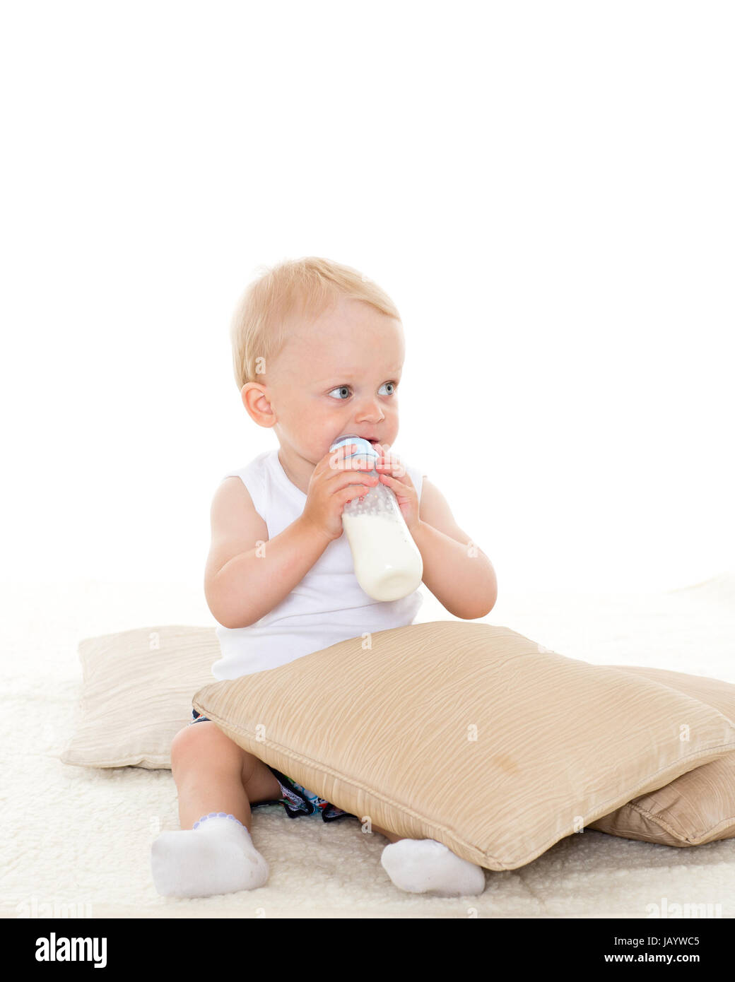 Little child drinks milk mix from bottle on a white background Stock ...