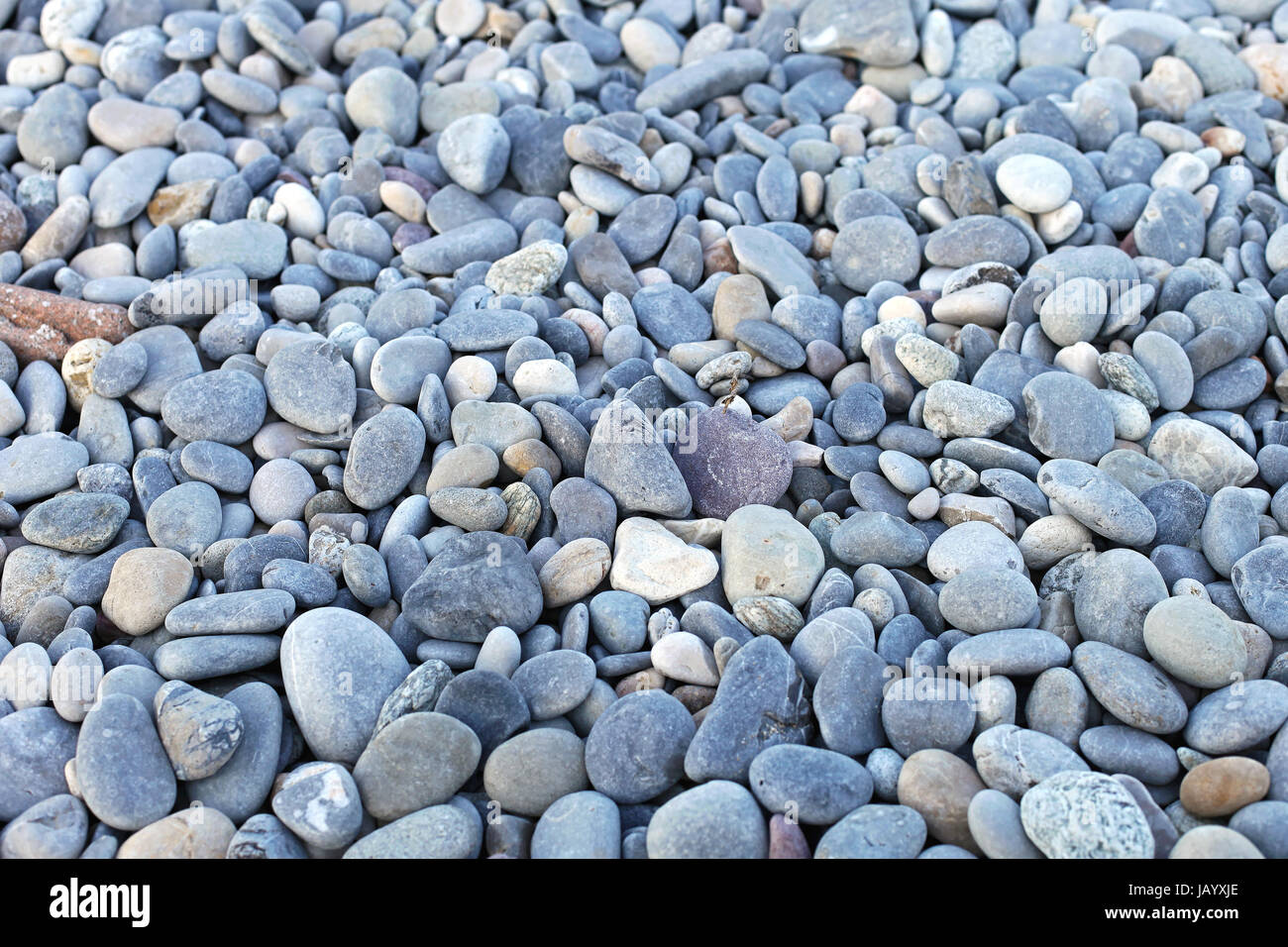 Big bunch of pebble stones Stock Photo - Alamy