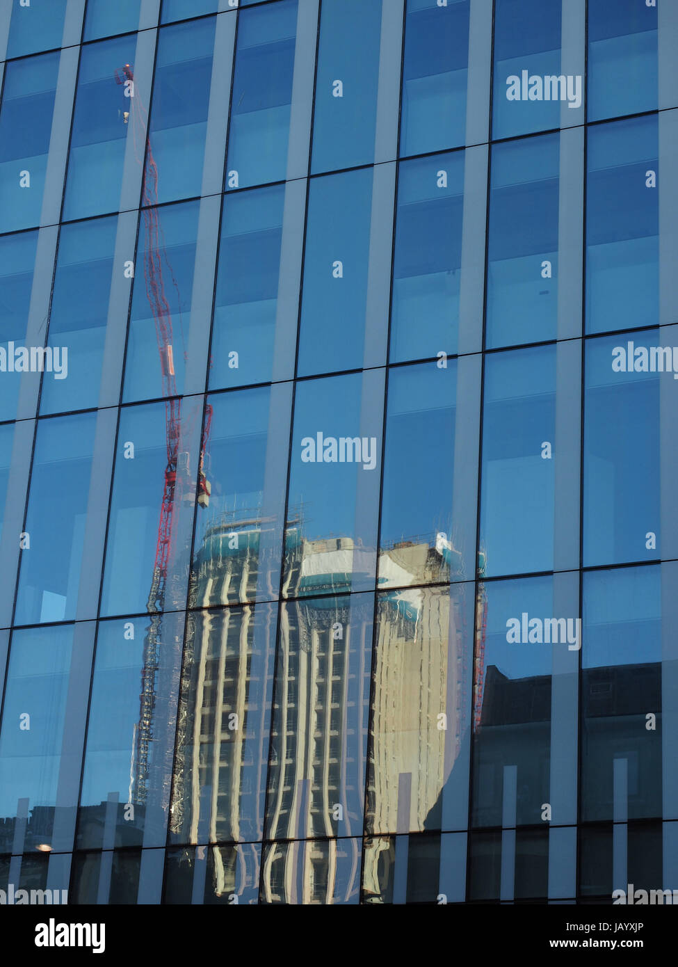 Reflection of a building under construction Stock Photo - Alamy