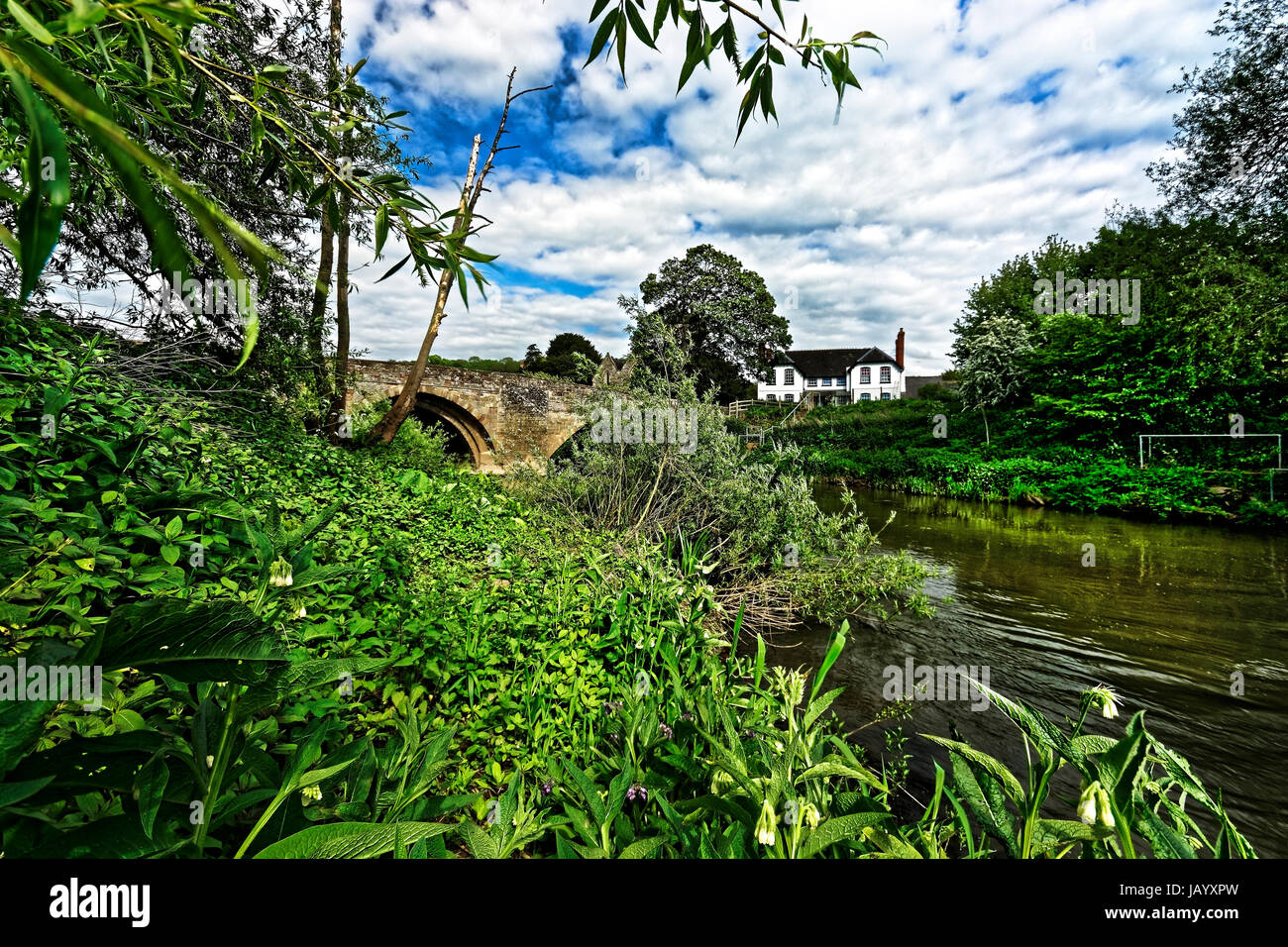 The bridge over a placid River Lugg at Mordiford Stock Photo - Alamy
