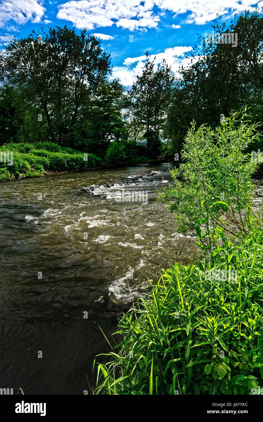 A view from the ancient bridge at Mordiford of a placid River Lugg ...