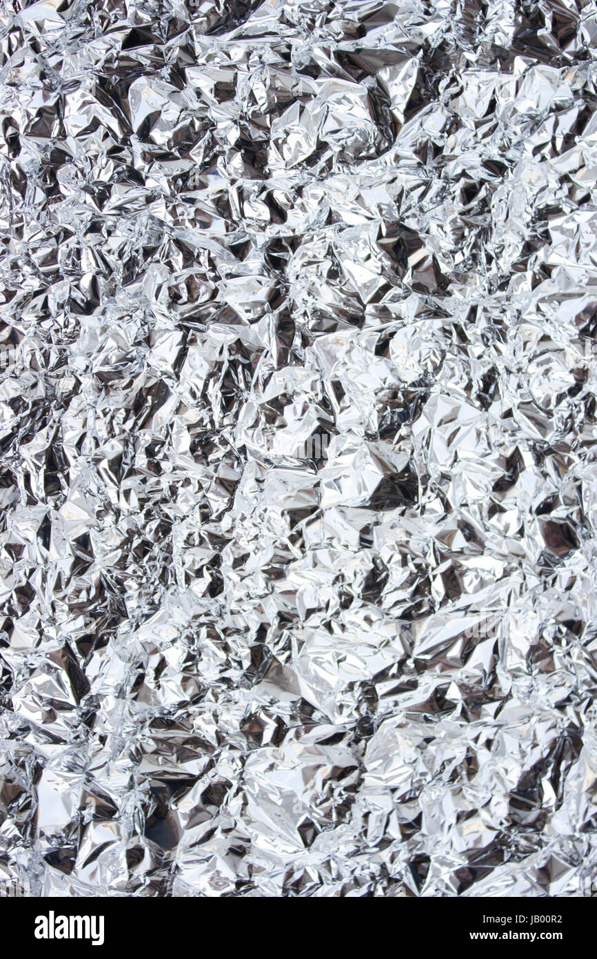 A wrinkled metallic foil texture design Stock Photo - Alamy