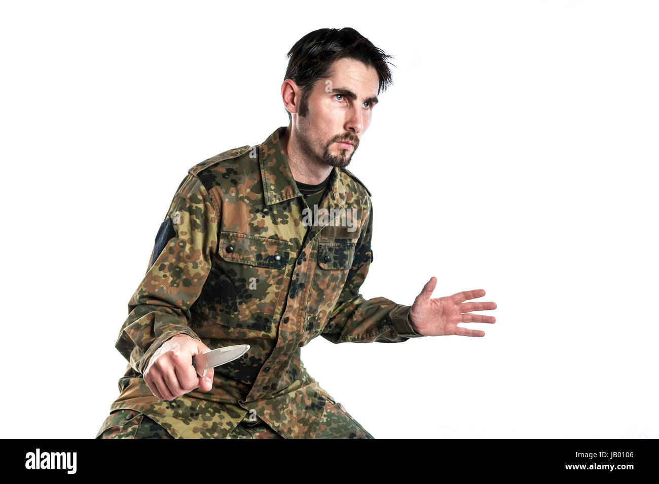 Male self defense instructor with camouflage do a self defense exercise ...