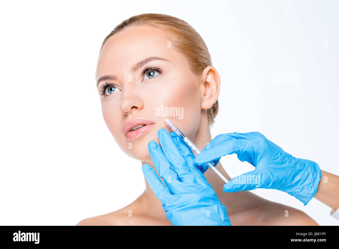 portrait of woman getting botox injection on white Stock Photo - Alamy