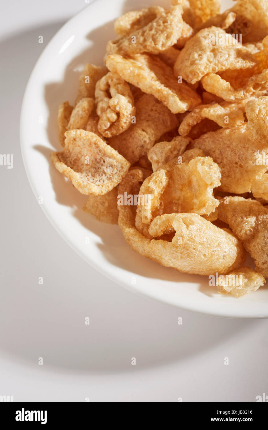 a bowl of fried pork skins Stock Photo - Alamy