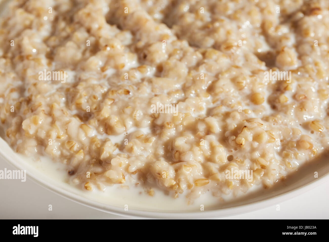 a bowl of cooked organic, pinhead, oatmeal Stock Photo - Alamy