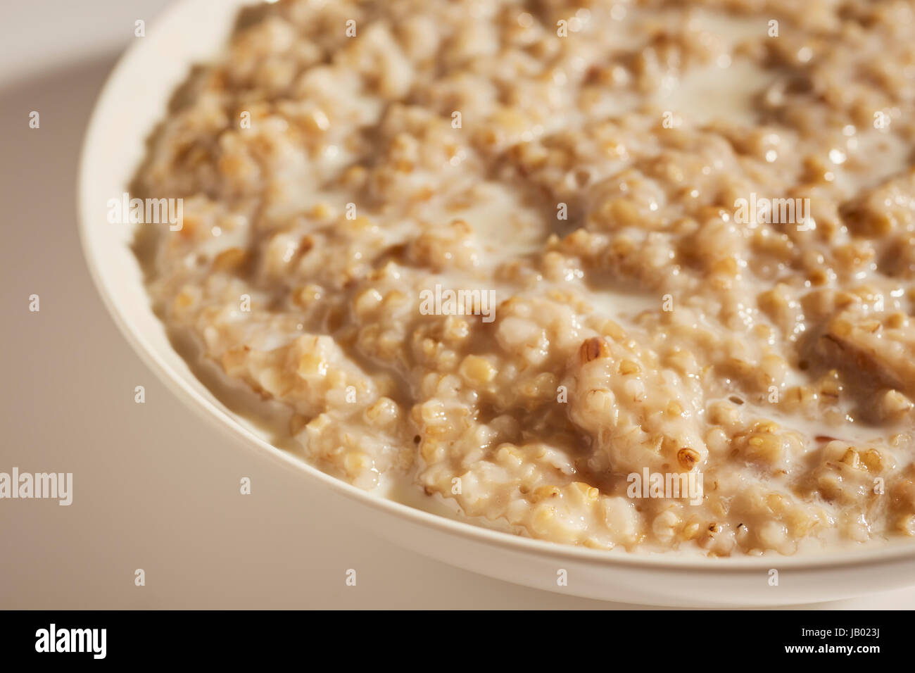a bowl of cooked organic, pinhead, oatmeal Stock Photo - Alamy