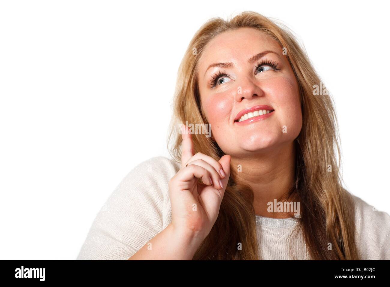 Portrait of young woman looking upwards on a white background Stock ...